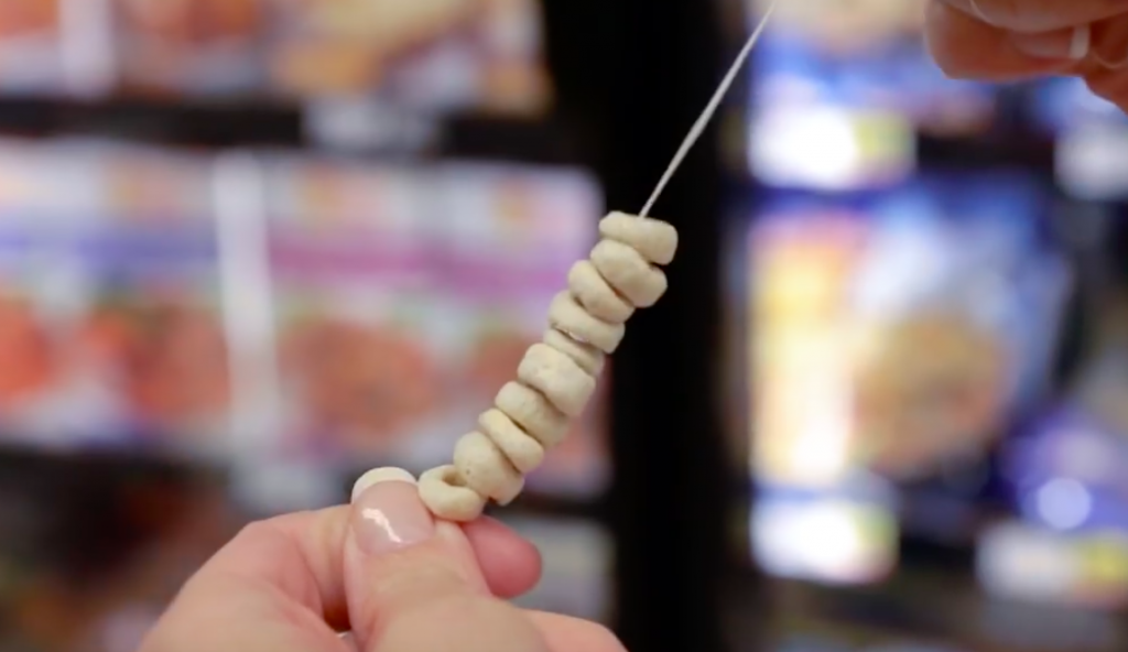 The Reason Why She Is Stringing Cheerios Onto Dental Floss is BRILLIANT ...