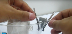 He Threads This Yarn Through A Binder Clip And Instantly Has The ...