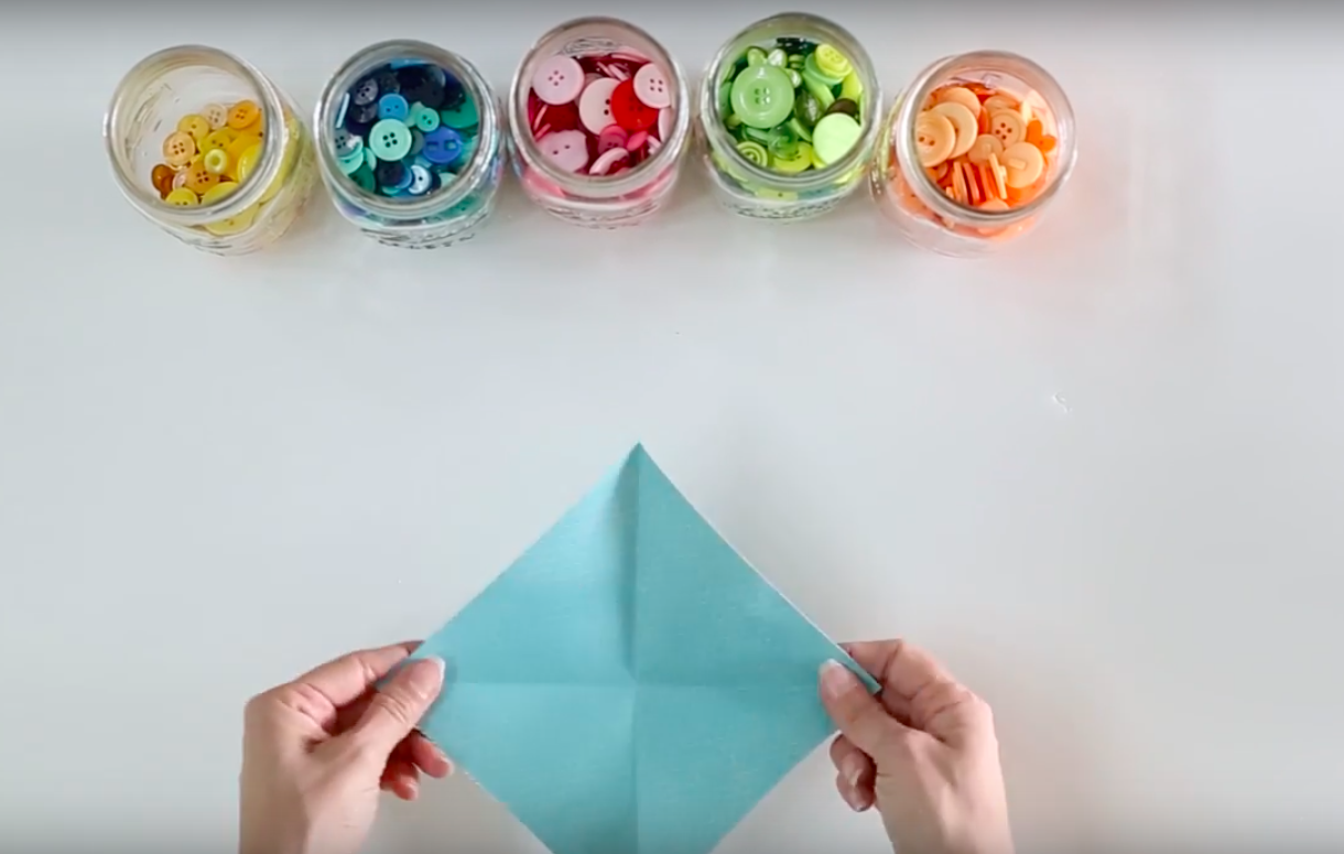She Uses One Small Piece Of Square Paper And A Button To Make An ...