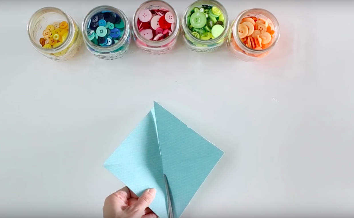 She Uses One Small Piece Of Square Paper And A Button To Make An ...