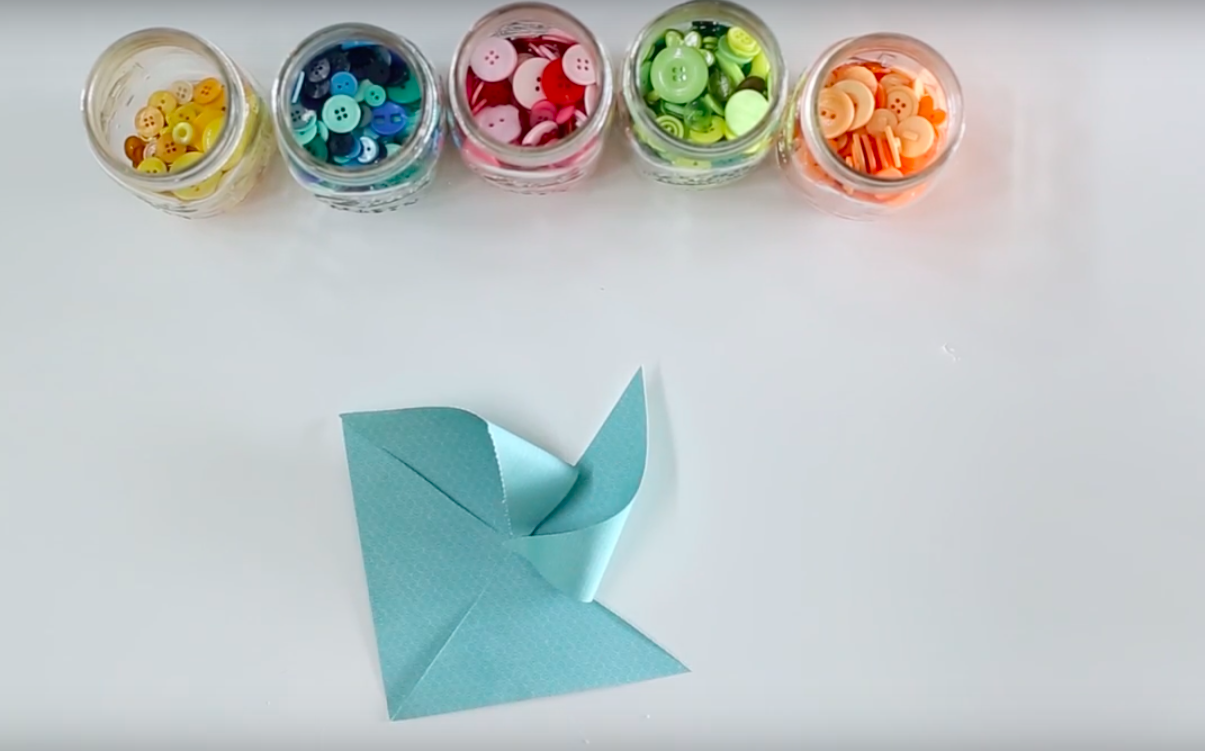 She Uses One Small Piece Of Square Paper And A Button To Make An ...